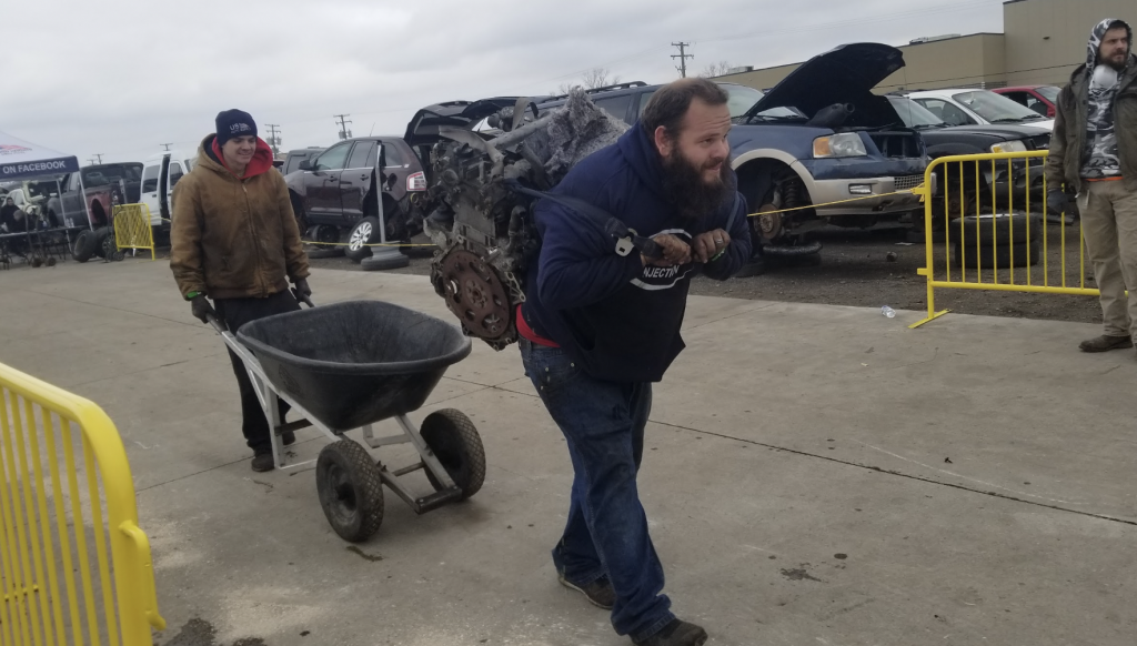 Watch In Awe As These Men Carry 300 Pound Engines And 500 Pound Axles ...