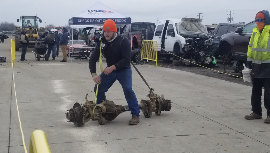 Watch In Awe As These Men Carry 300 Pound Engines And 500 Pound Axles ...