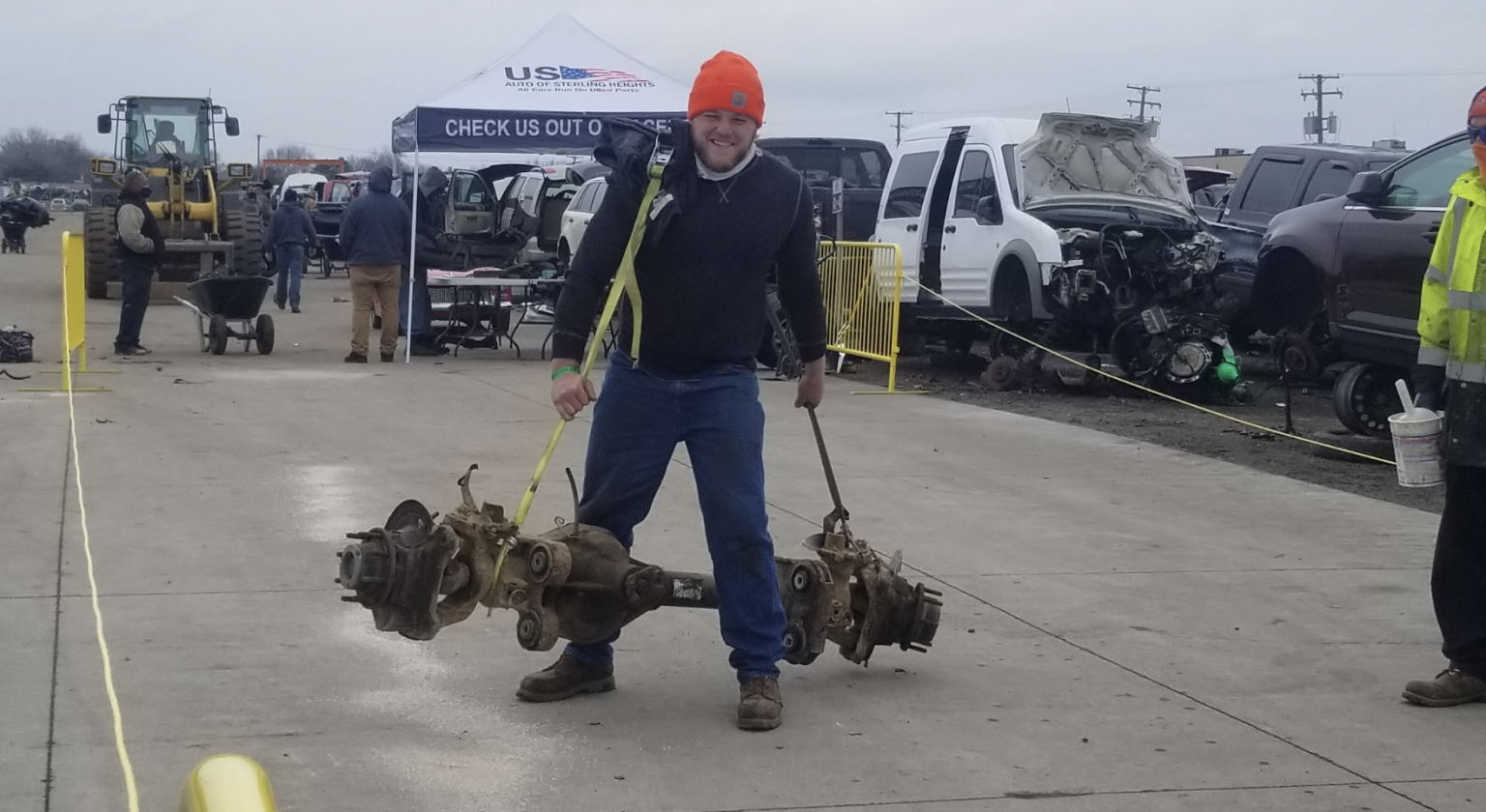Watch In Awe As These Men Carry 300 Pound Engines And 500 Pound Axles ...