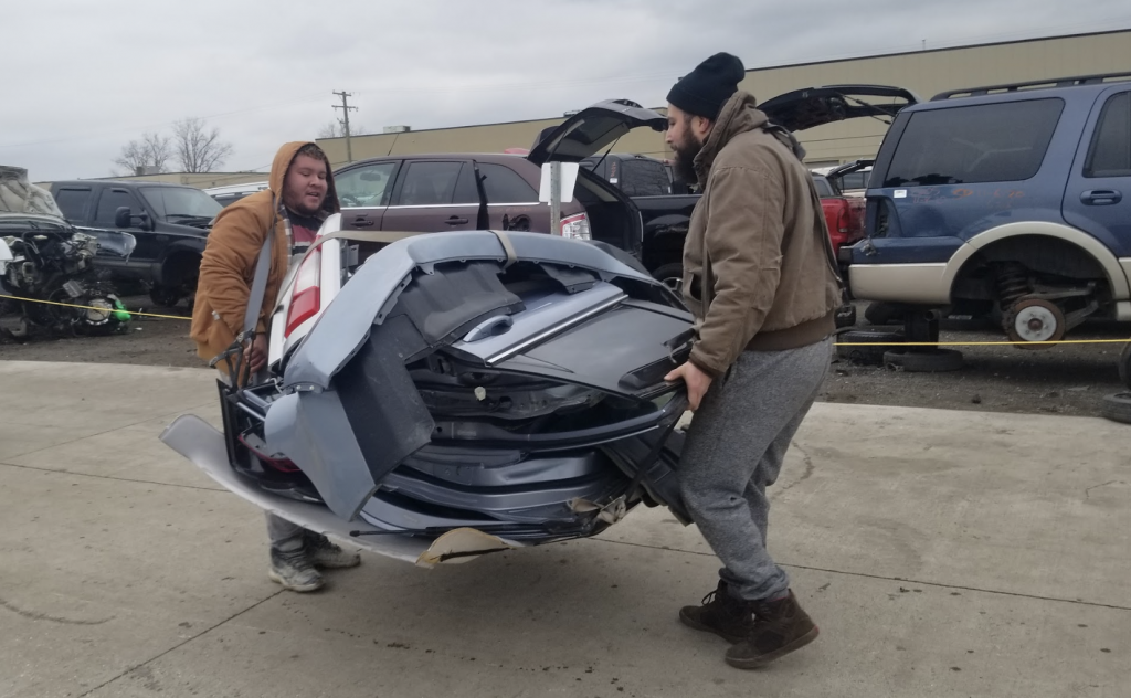Watch In Awe As These Men Carry 300 Pound Engines And 500 Pound Axles ...