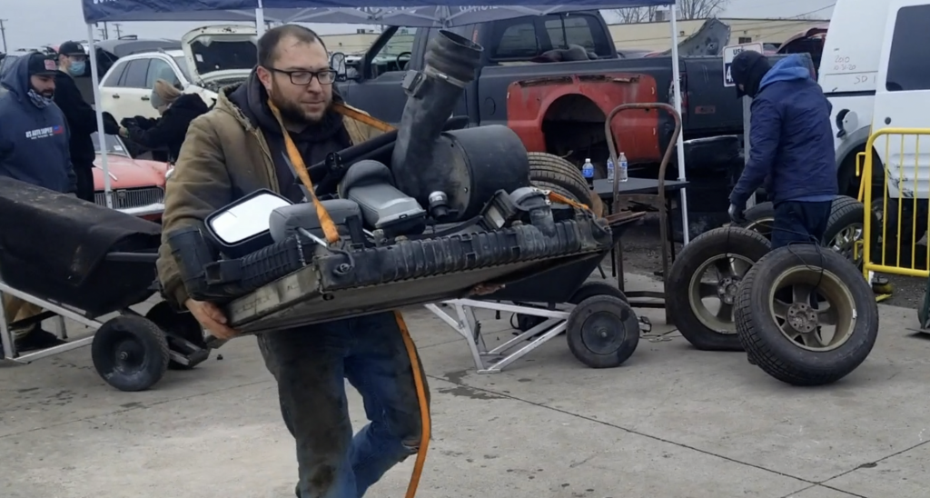 Watch In Awe As These Men Carry 300 Pound Engines And 500 Pound Axles ...